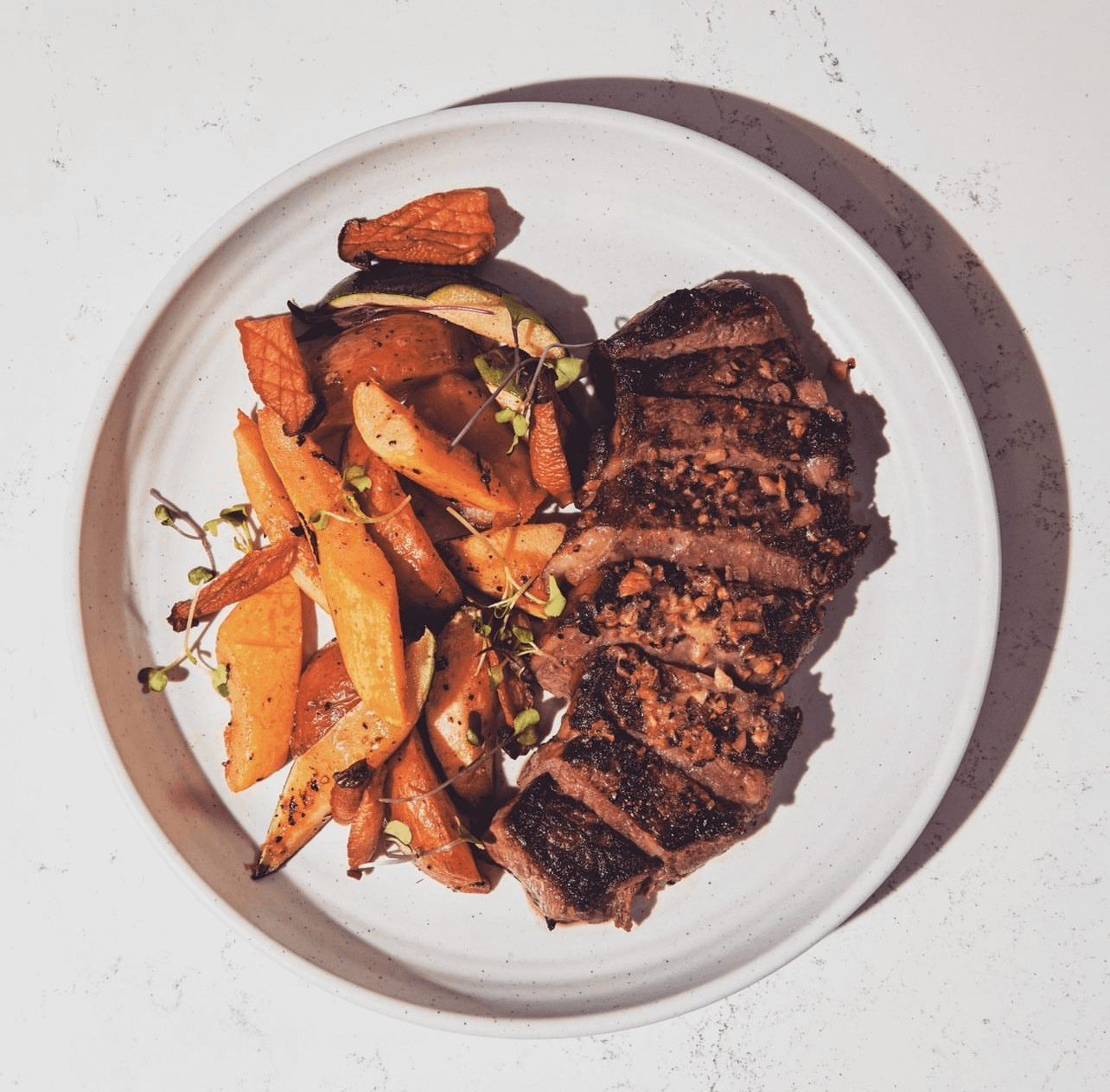 10oz Kc strip topped with a marsala butter, served with roasted ...