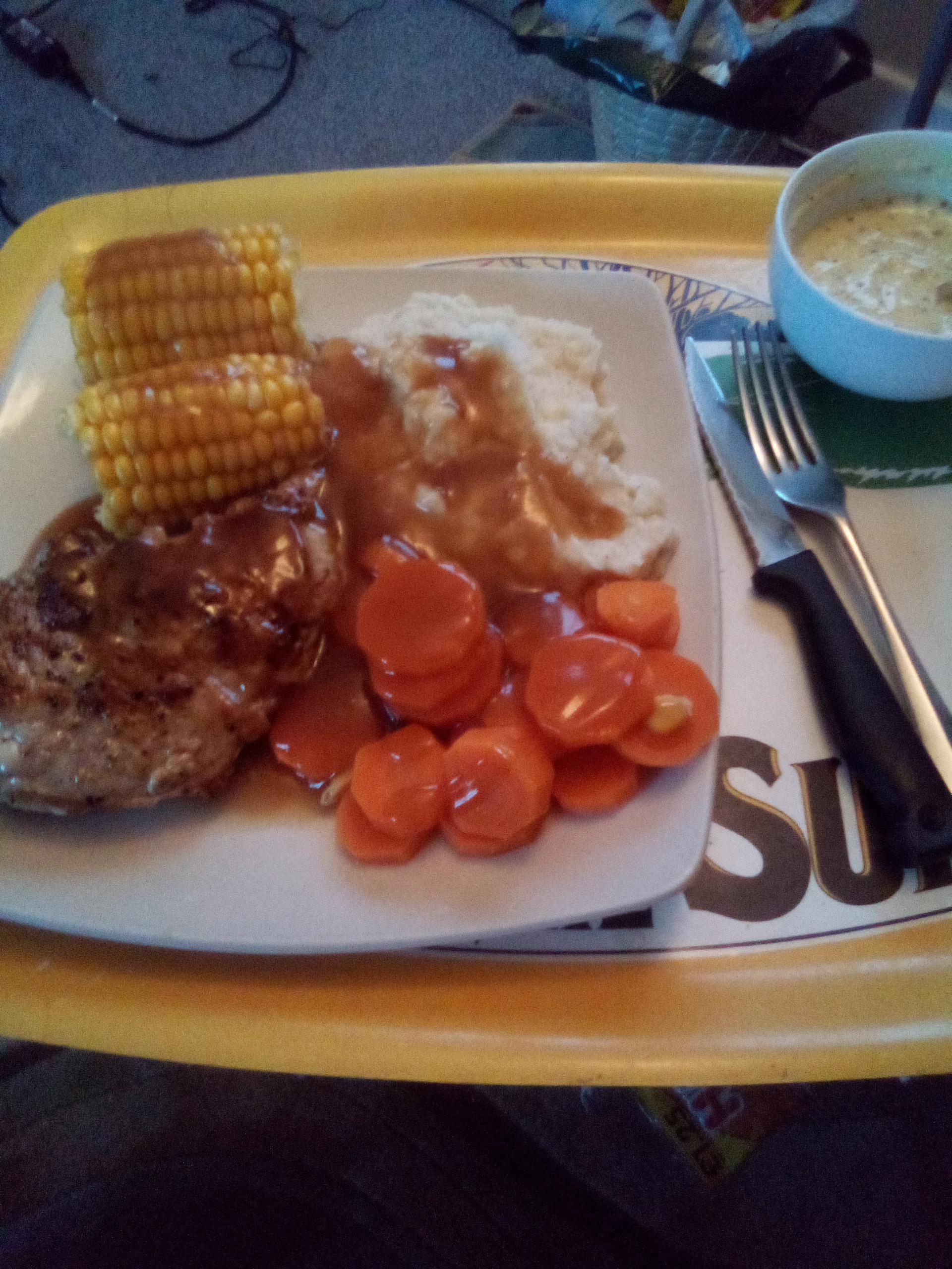 Greedy piggy pork chop, taters, carrots and corn with gravy and mustard ...