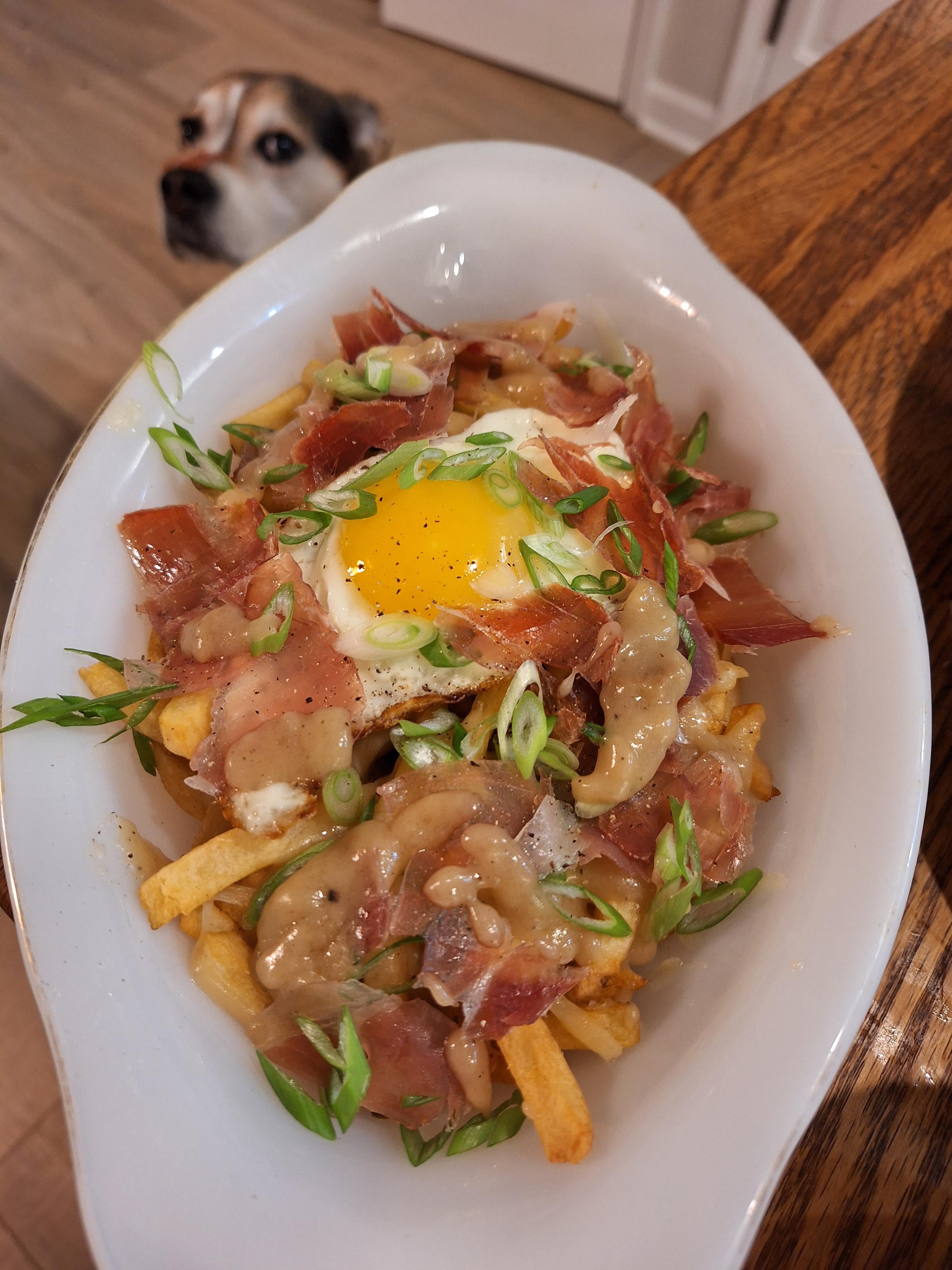 Poutine with jamon, shredded white cheddar, pork gravy, and an egg ...
