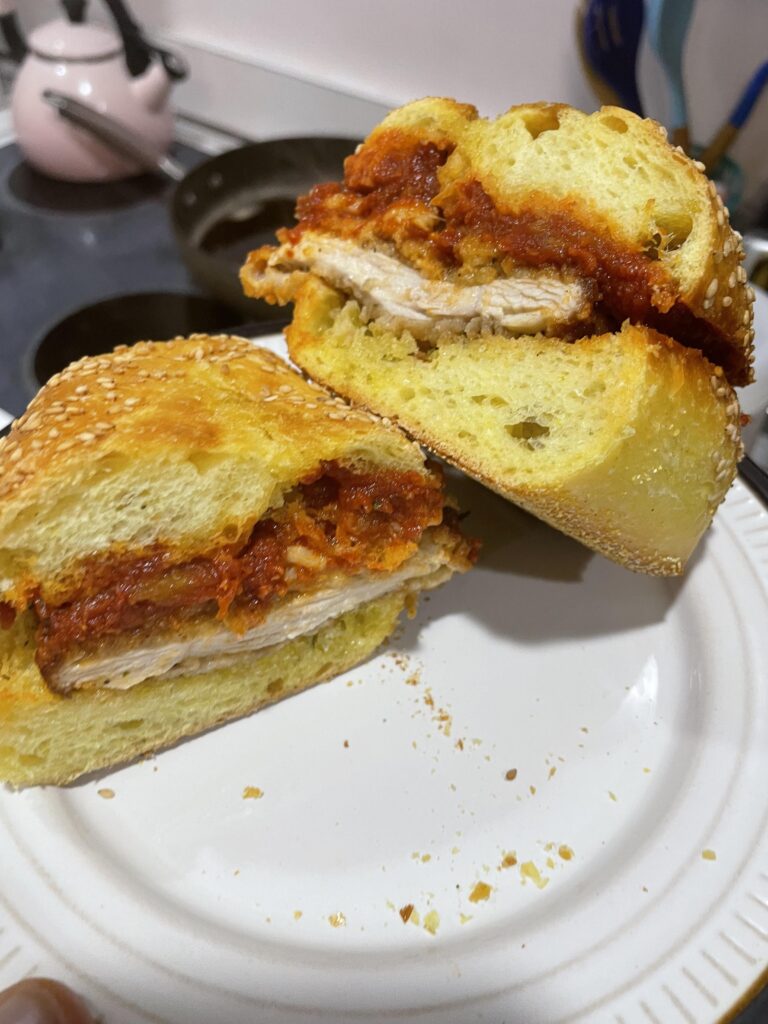 Chicken parmigiana, on garlic semolina bread. - Dining and Cooking
