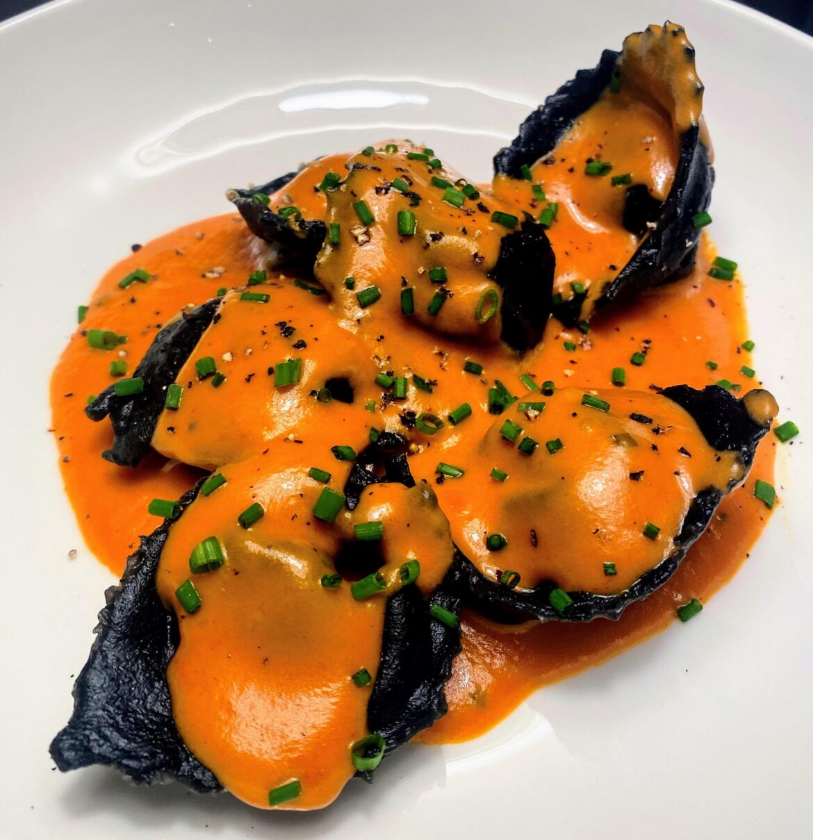 Squid ink lobster tortelloni in a bisque sauce - Dining and Cooking