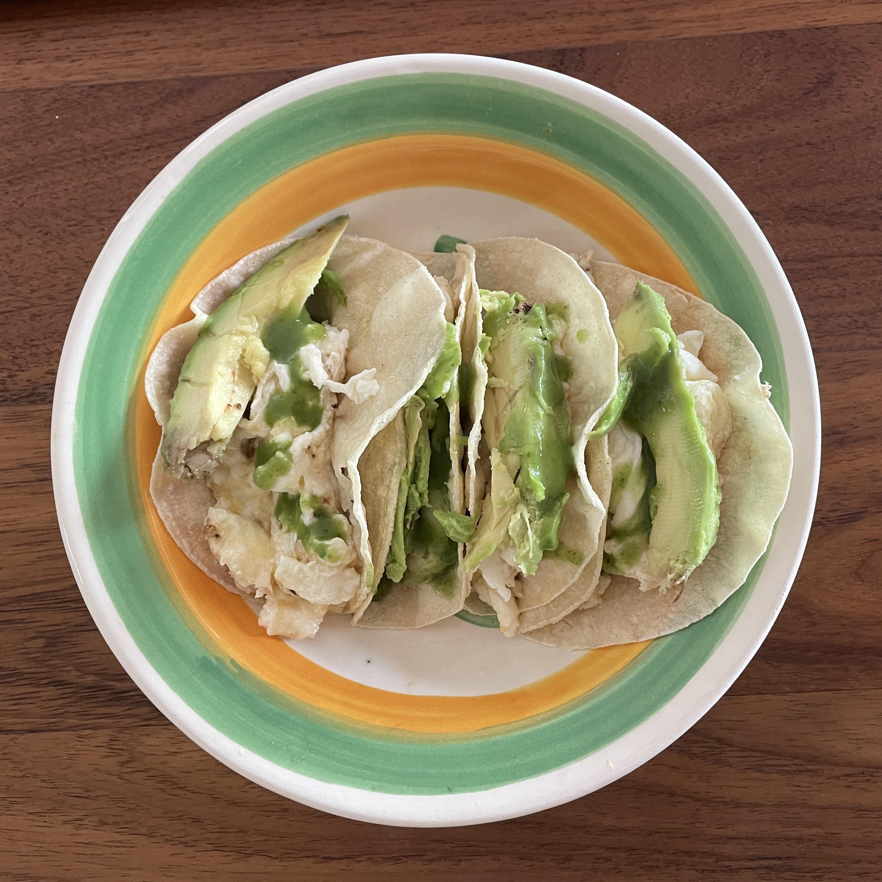 Simple breakfast tacos with egg whites, cheese, avocado, and hot sauce ...