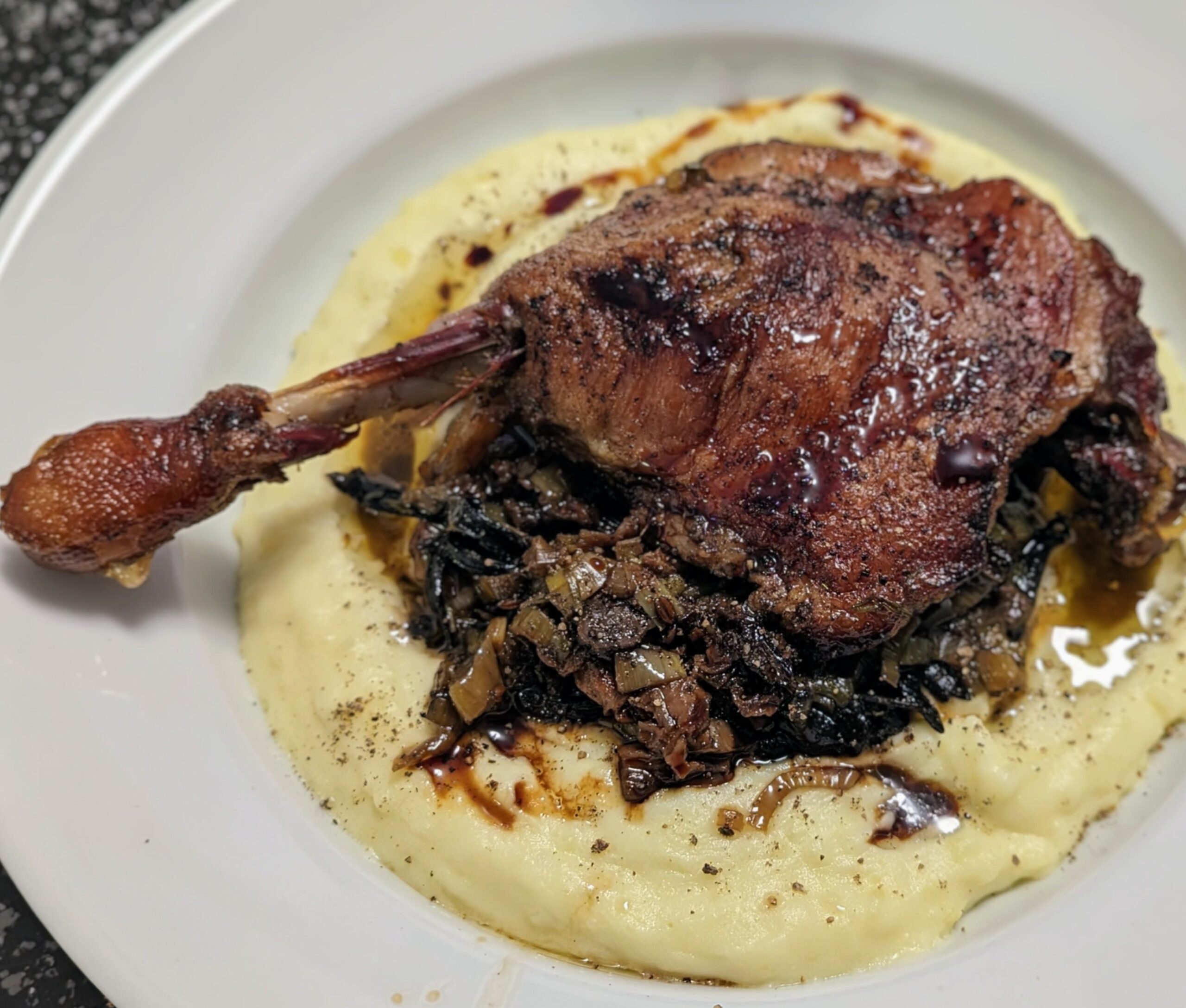 Braised duck leg w/ leeks and wild mushrooms over mashed homegrown ...