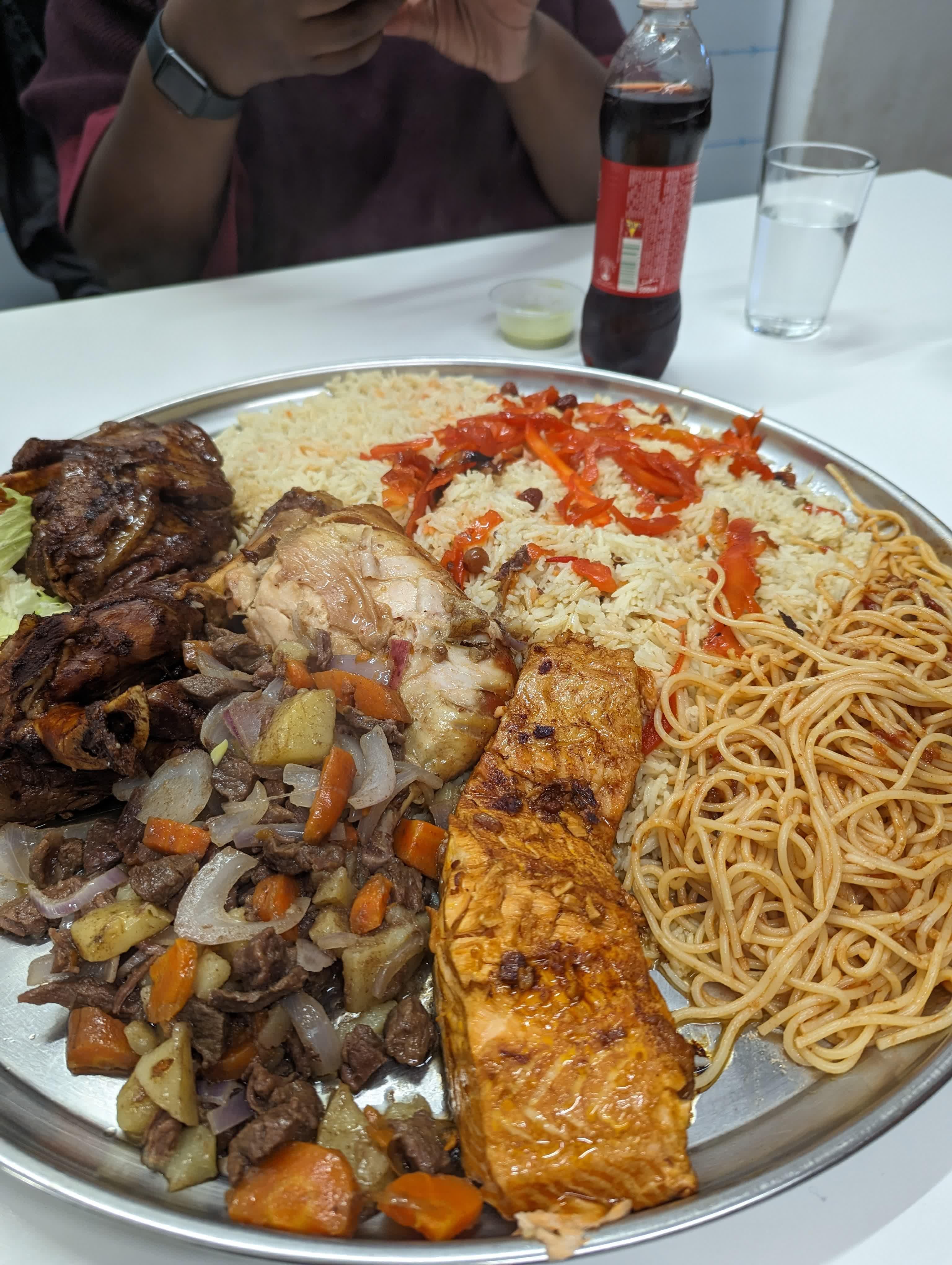 [I ate] a Somalian Platter with Lamb Shank, Salmon, Beef, Chicken, Rice ...
