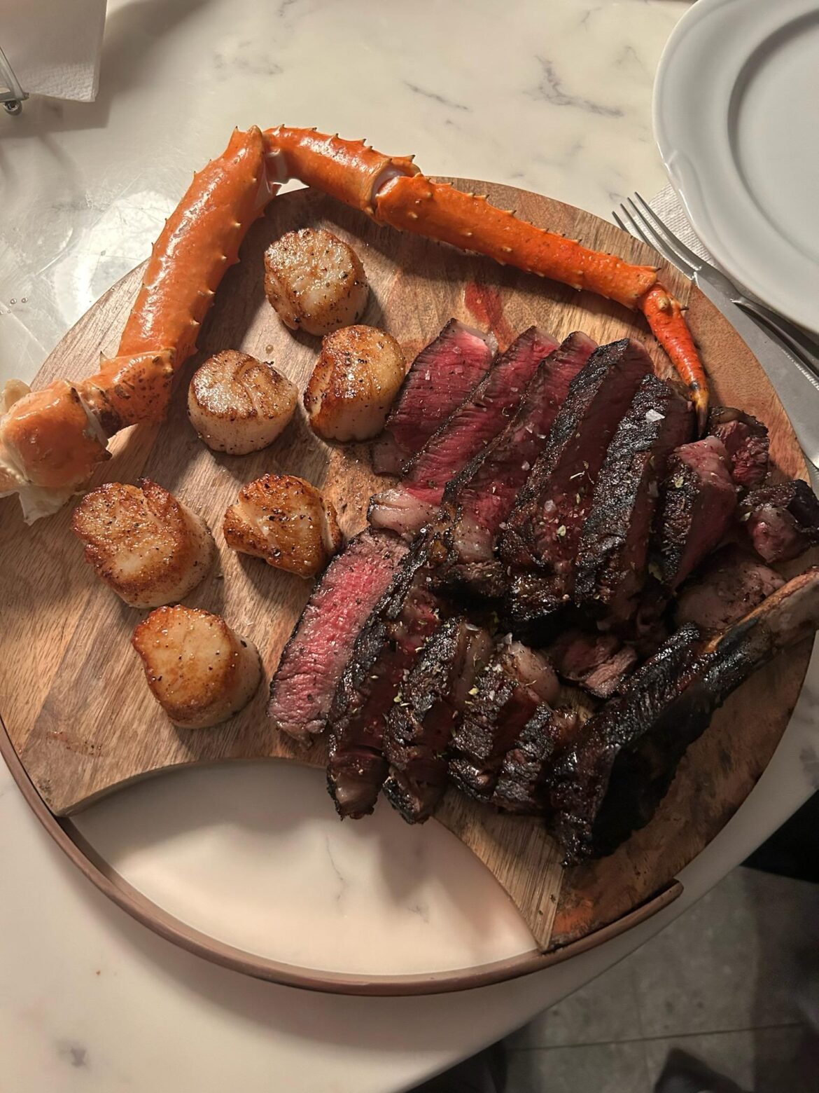 NYE Dinner. Ribeye steak, seared scallops, and a king grab leg ...