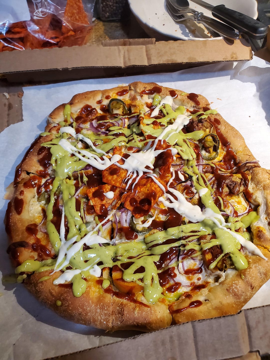 I present to you: taquito-stuffed crust pizza topped with mini tacos ...