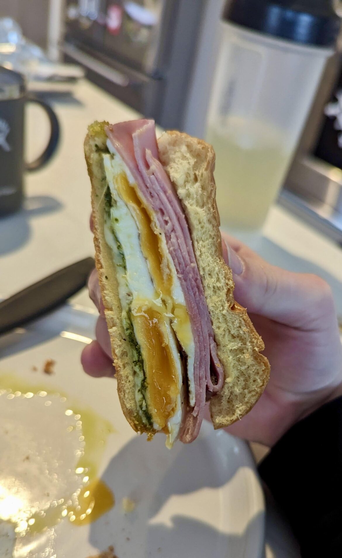 Breakfast sammy with ham, egg, pepperjack, and pesto on a brioche bun ...