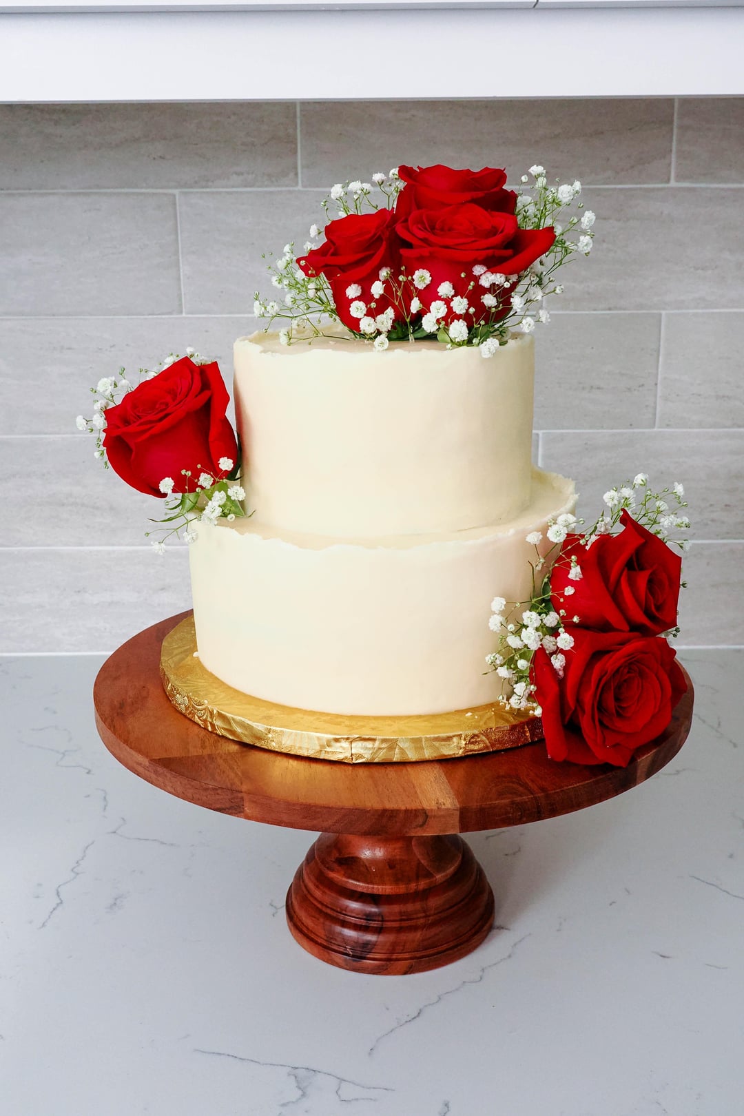 Simple tiered wedding cake with deckled edges, roses, and baby's breath - Dining and Cooking