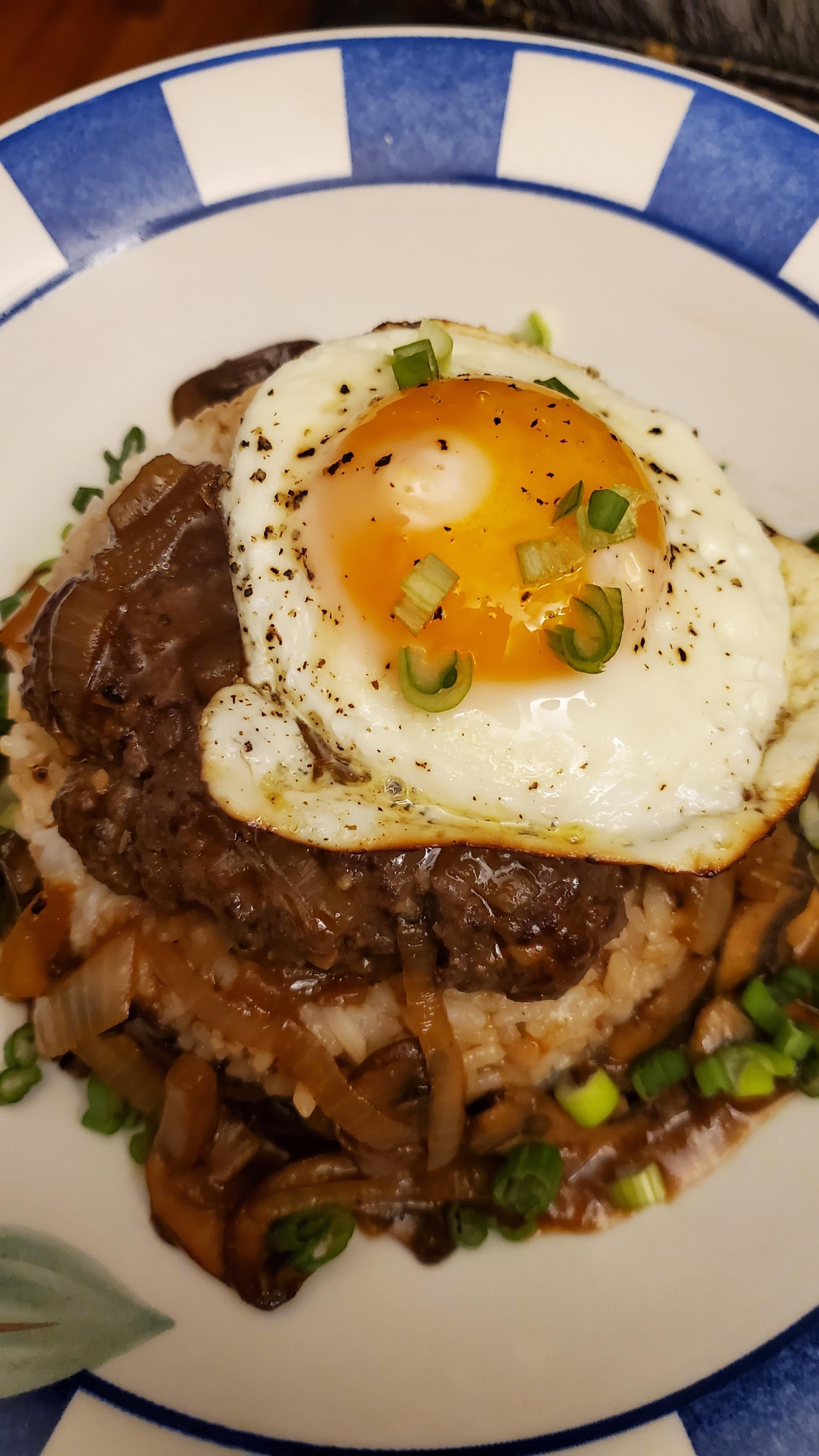 [Oc] Hawaiian Loco Moco. Seasoned beef patty on bed of rice smothered in rich brown mushroom ...