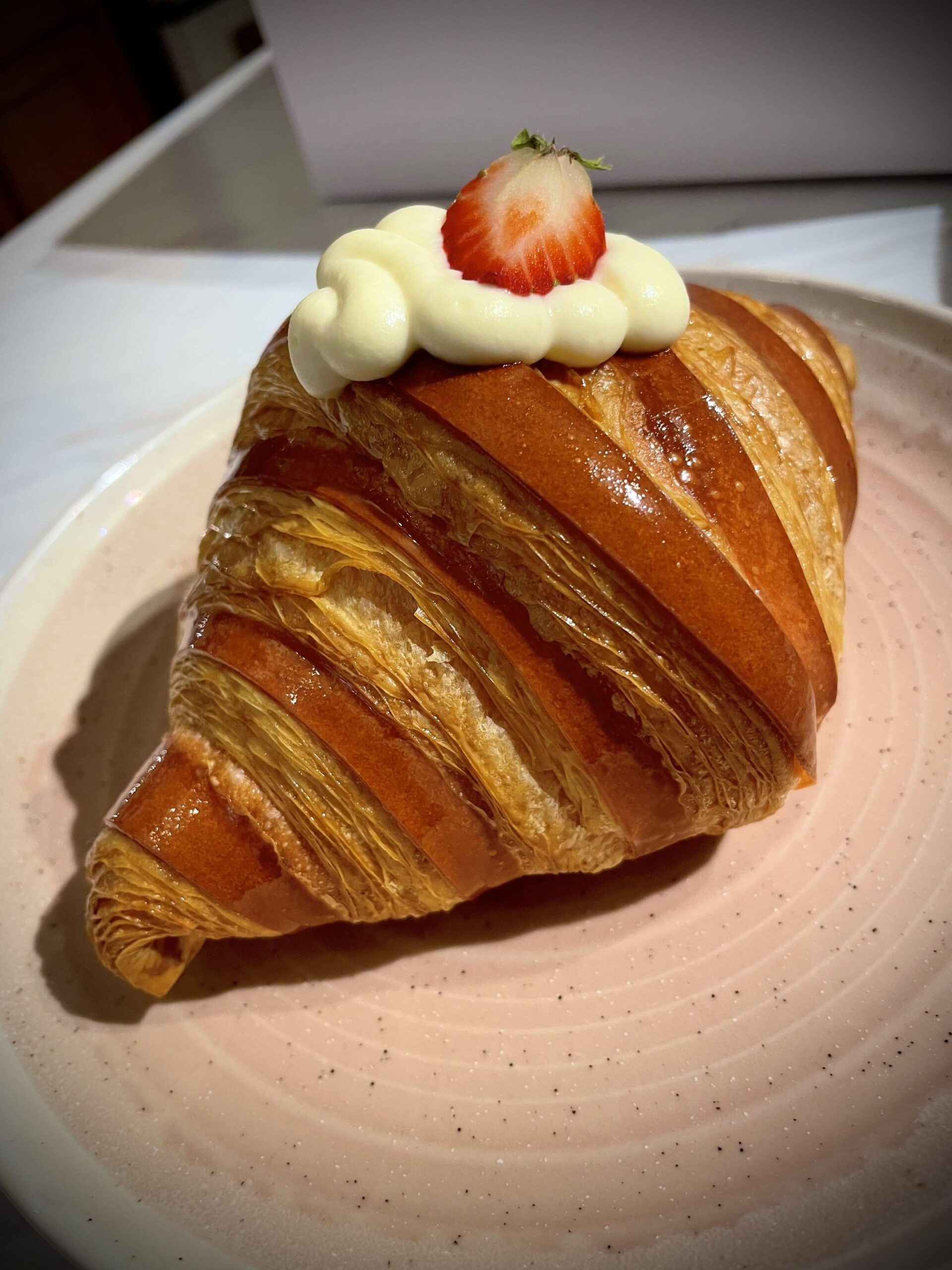 Strawberries and cream filled croissant from a local bakery this AM ...