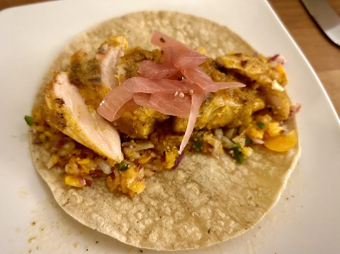 Tandoori salmon taco with goldenberry salsa and pickled onion - Dining ...