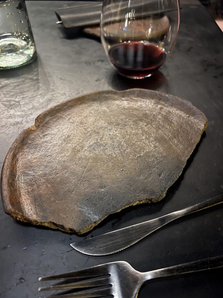 Sort of a plate, but actually just a broken off chunk of plate. At a ...