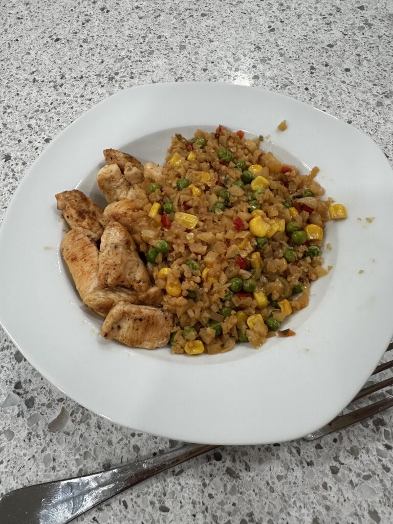 Easy 300 calorie dinner! 4oz chicken breast and 210g of TJ's riced cauliflower stir fry ...