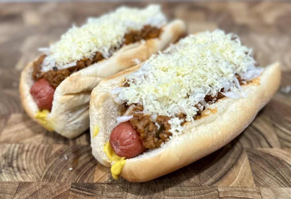 [homemade] sloppy dogs (beef dogs, sloppy joe, onion, vermont cheddar ...