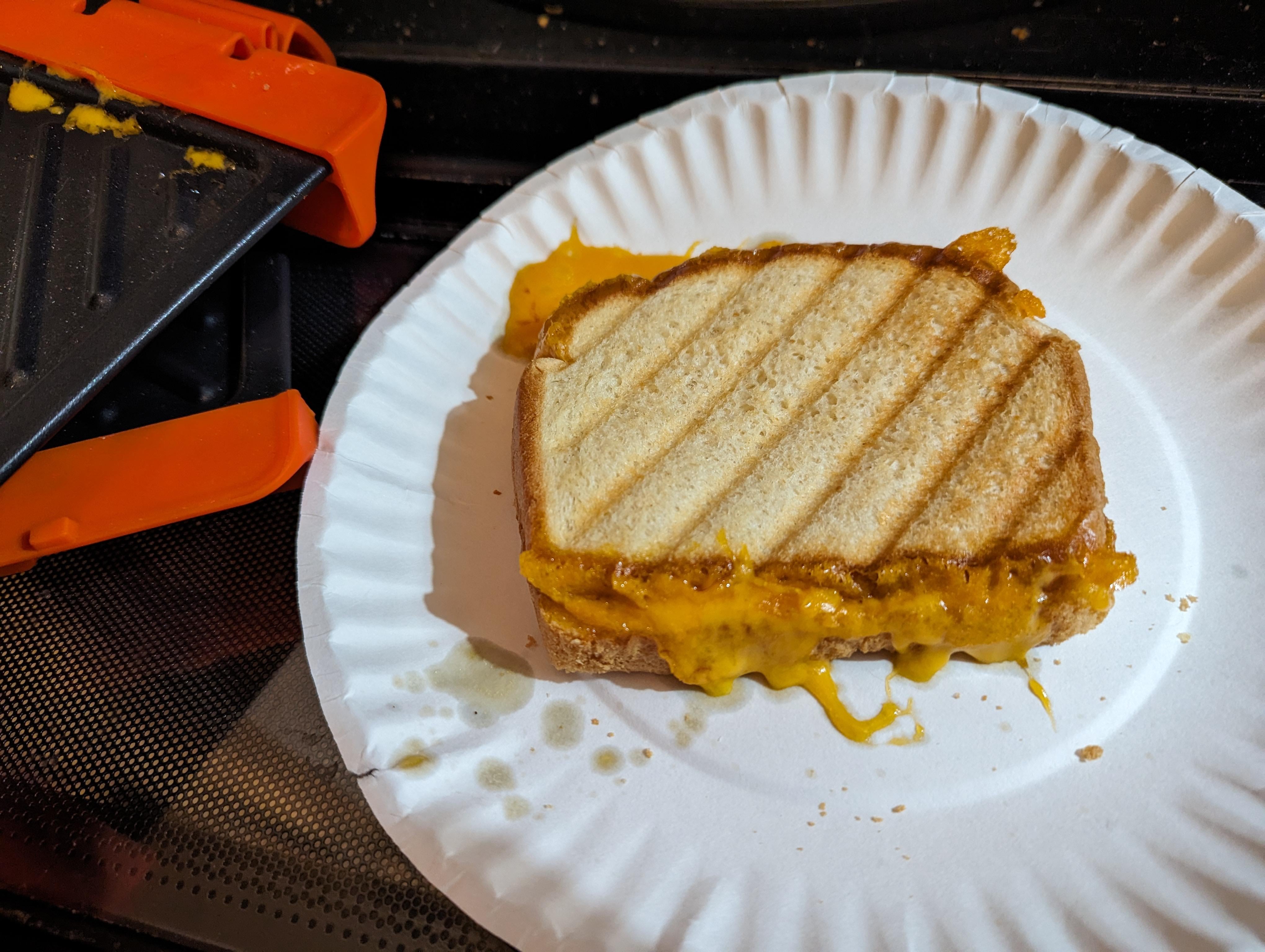Sharp Cheddar on generic white bread in microwave inside toastie plates ...
