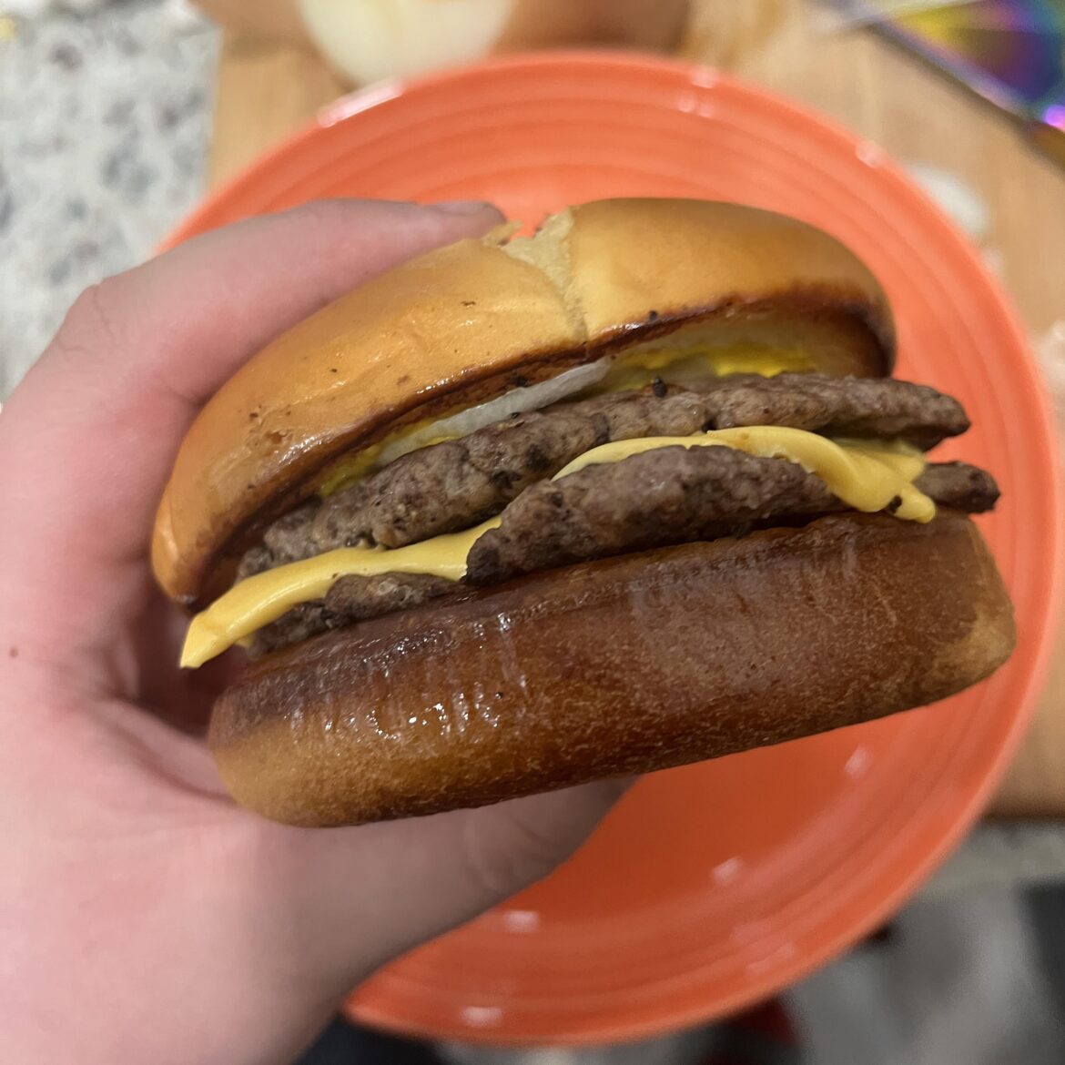 Evening smash burger, brioche bun, mustard, onion (out of pickles ...