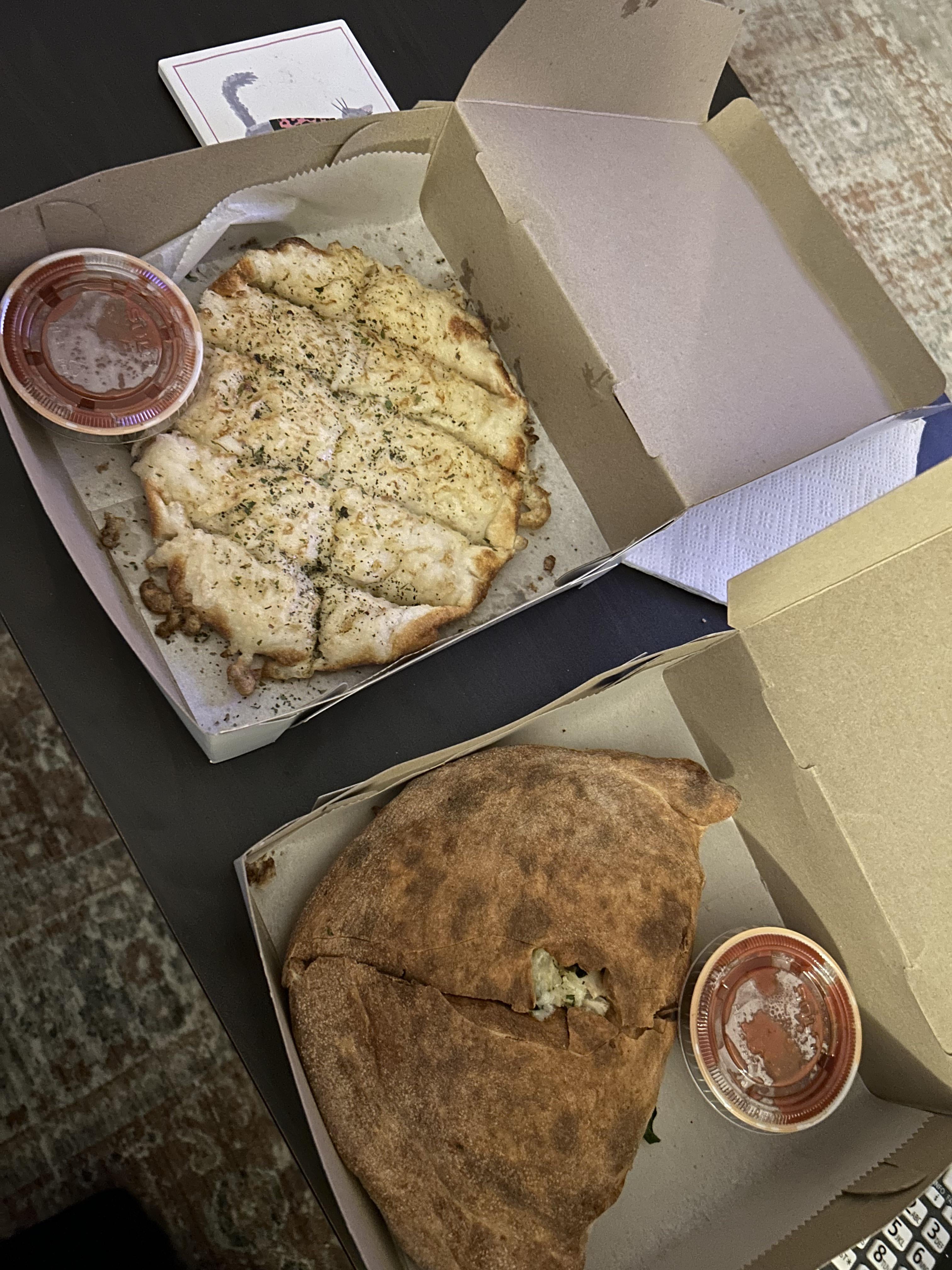 Cheesy bread and a calzone with spinach, daiya mozzarella and gardein ...