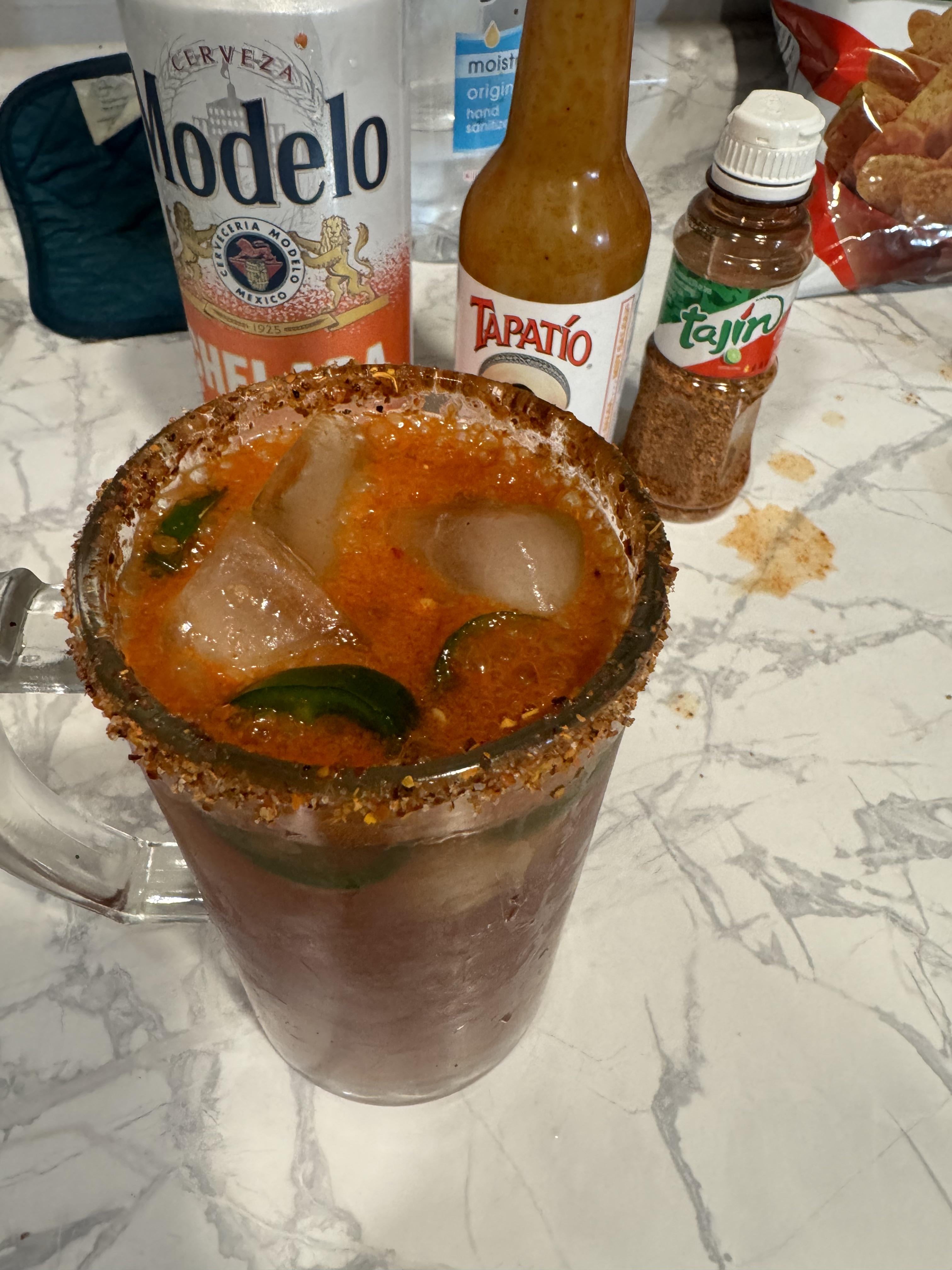 Michelada with Tapatio Tajin lime and jalapeño slices and Jugo Maggi ...