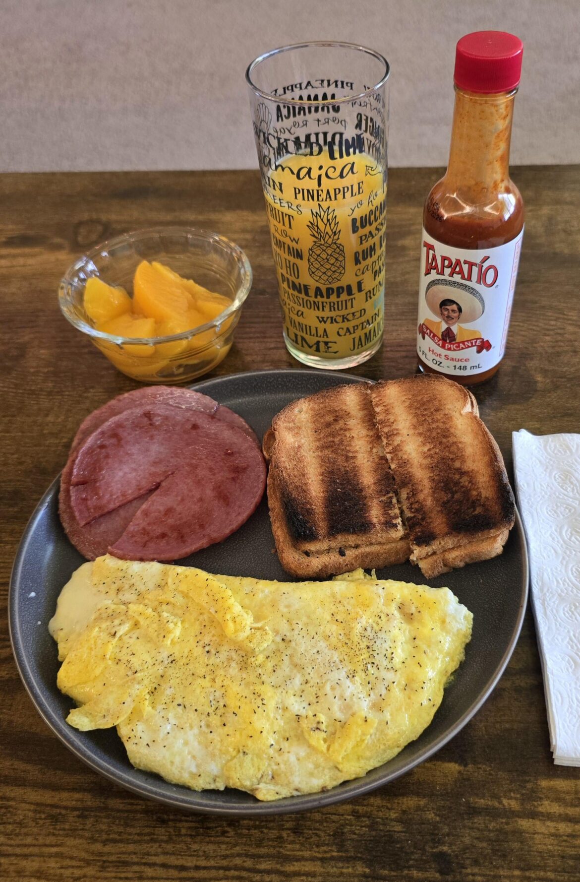 A simple pre-vacation breakfast. (Cheese omelette, pork roll, toast ...