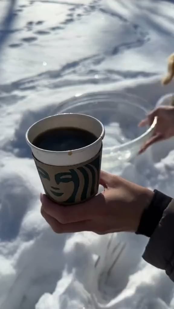 Lady makes "Snow Latte" (iced coffee) with snow then pretends to drink ...