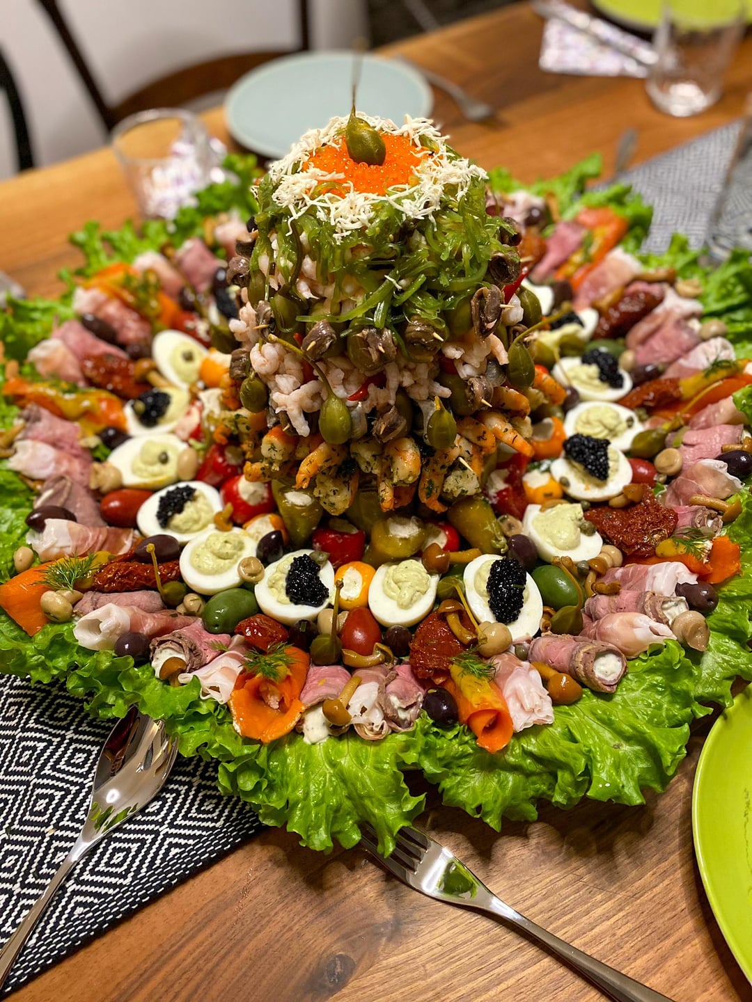 House-made antipasti volcano erupting with variations of fish and meat ...