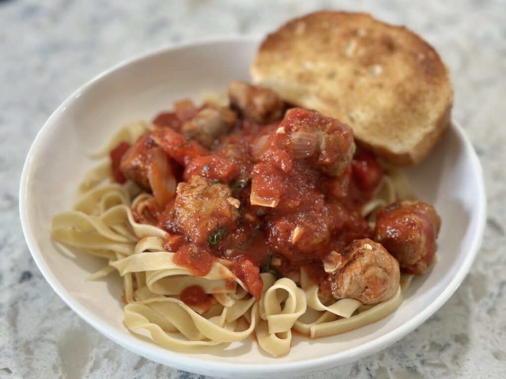 Fresh pasta with sweet Italian sausage and a homemade tomato-basil ...