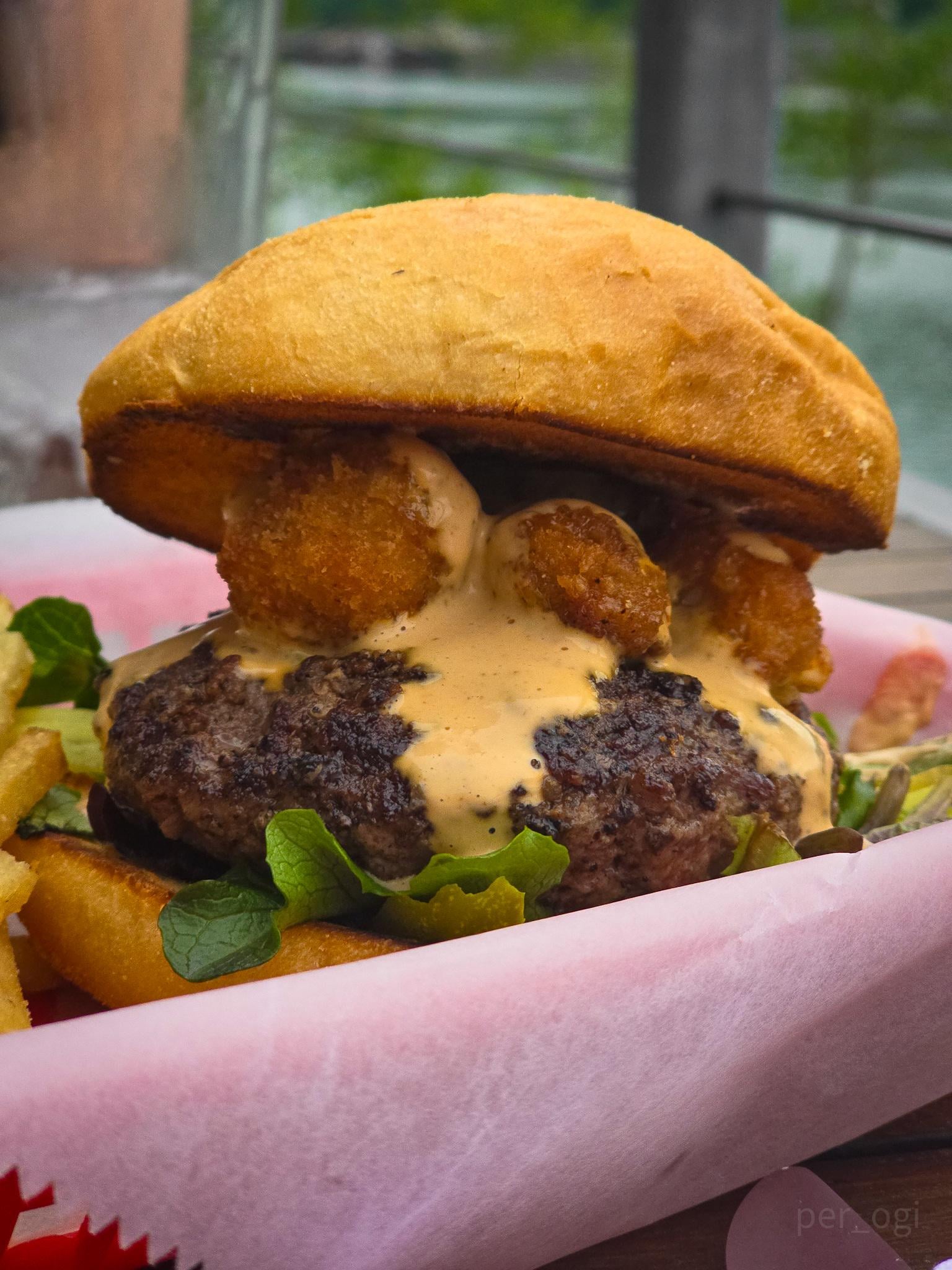 Burger w/ habanero dusted cheese curds, lettuce, pickles, and ancho ...