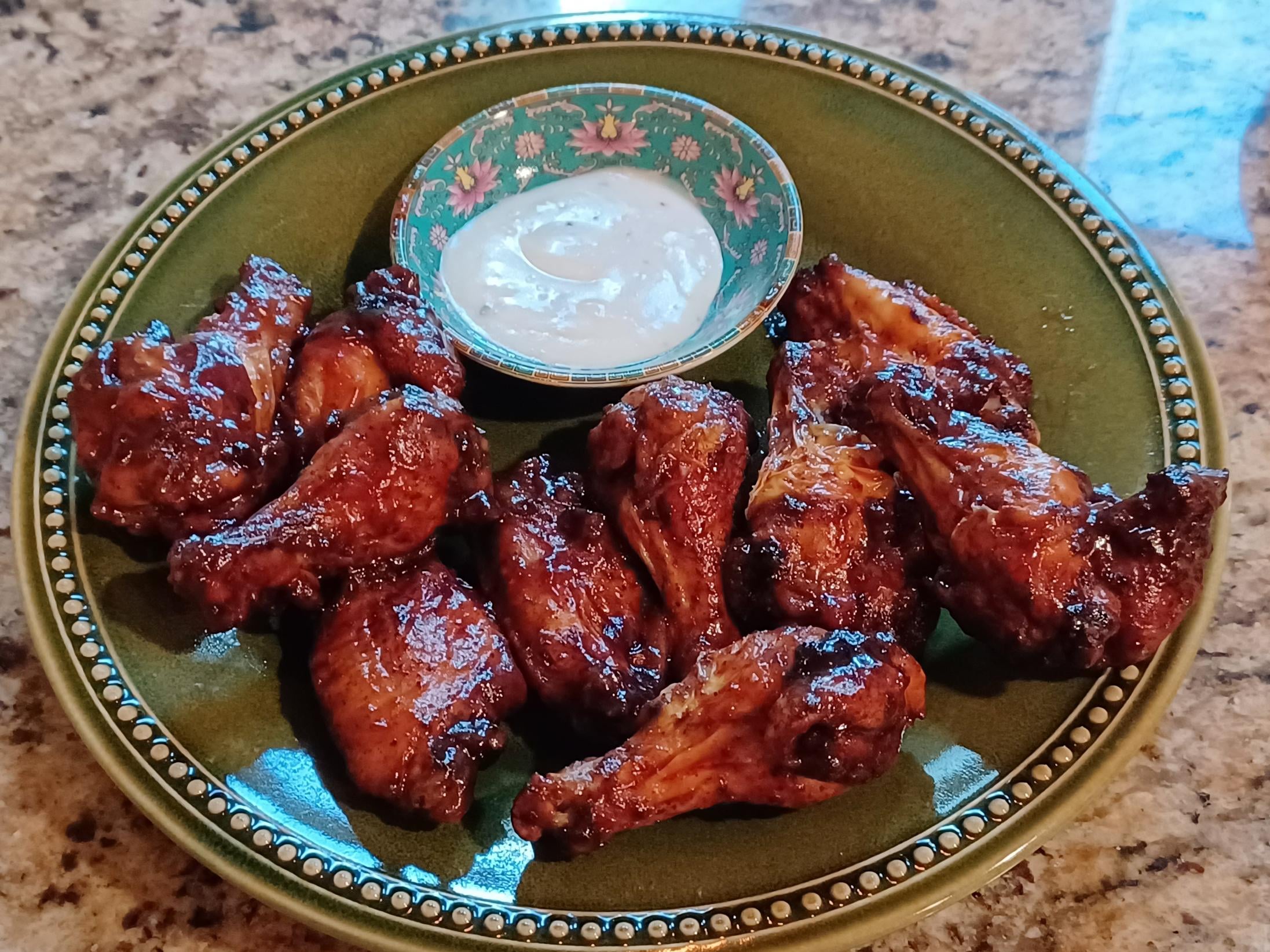 Tossed half in BBQ sauce and the other half in 'nuclear' wing sauce ...