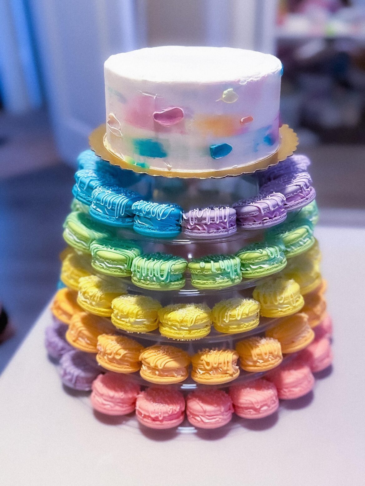 Rainbow macaron tower with matching cake - Dining and Cooking