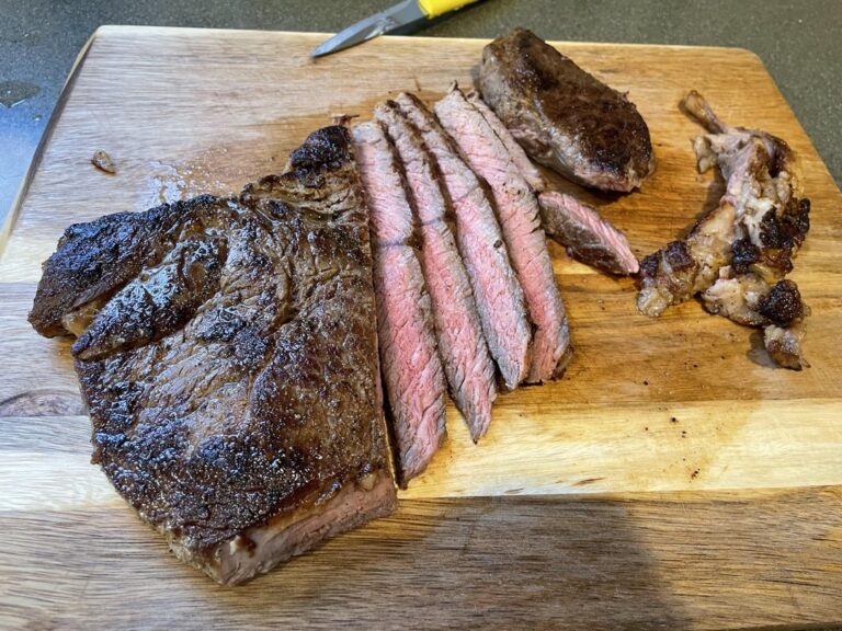 Grown man with kids learning to cook steak for the first time. Third ...