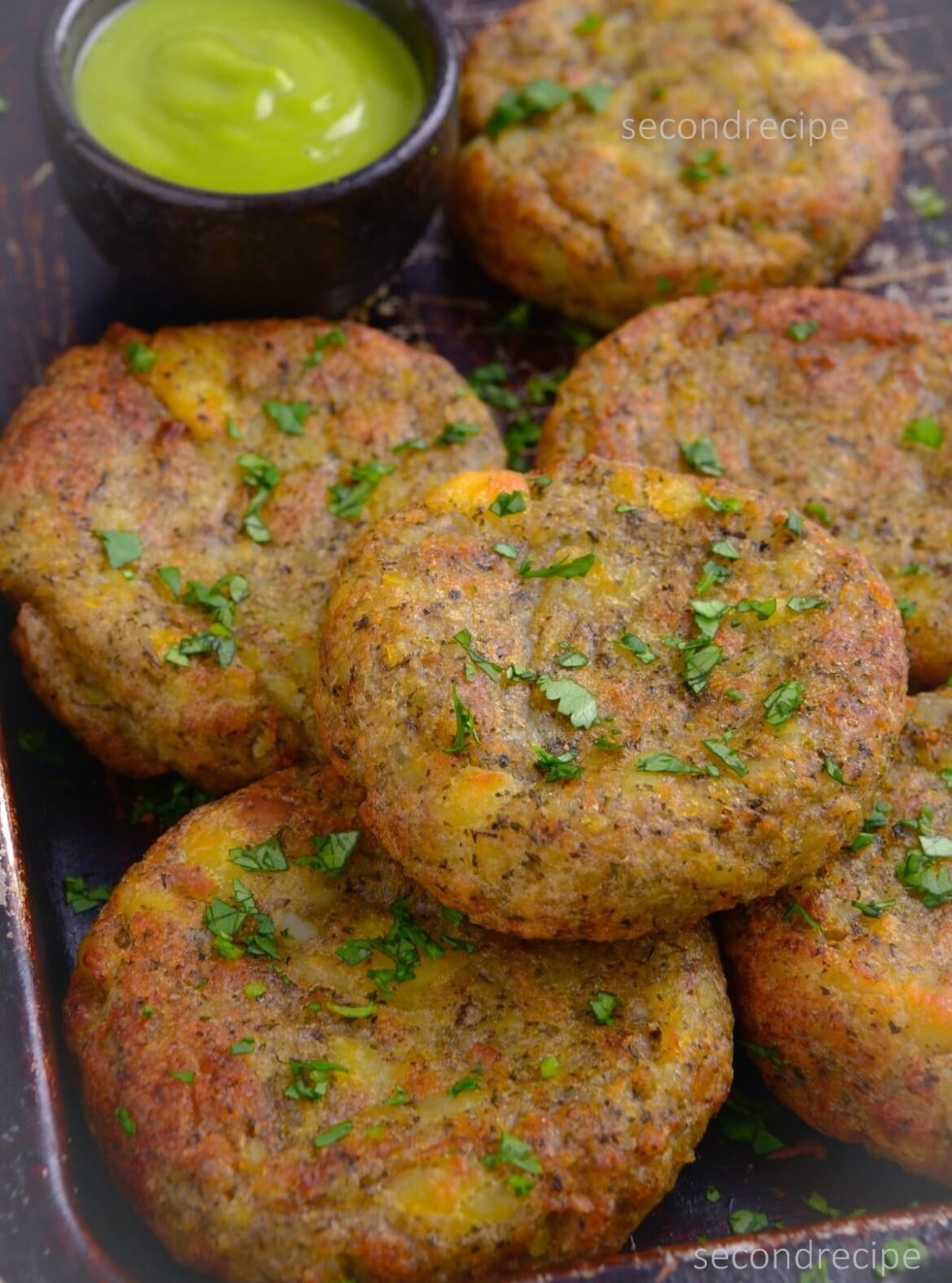 Aloo tikki - spicy potato cutlets,a Indian street food recipe cooked in ...