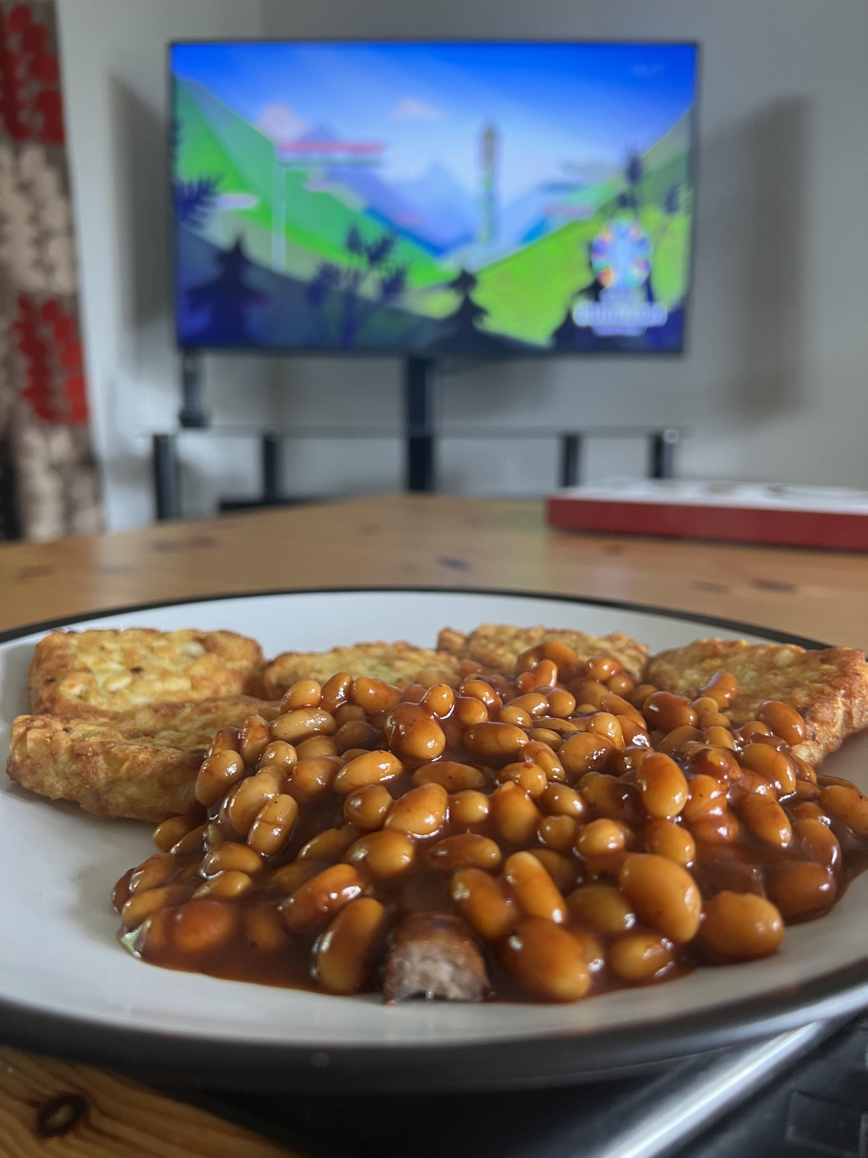 Burnt sausages rehydrated with peri peri beans and 5 hash browns ...