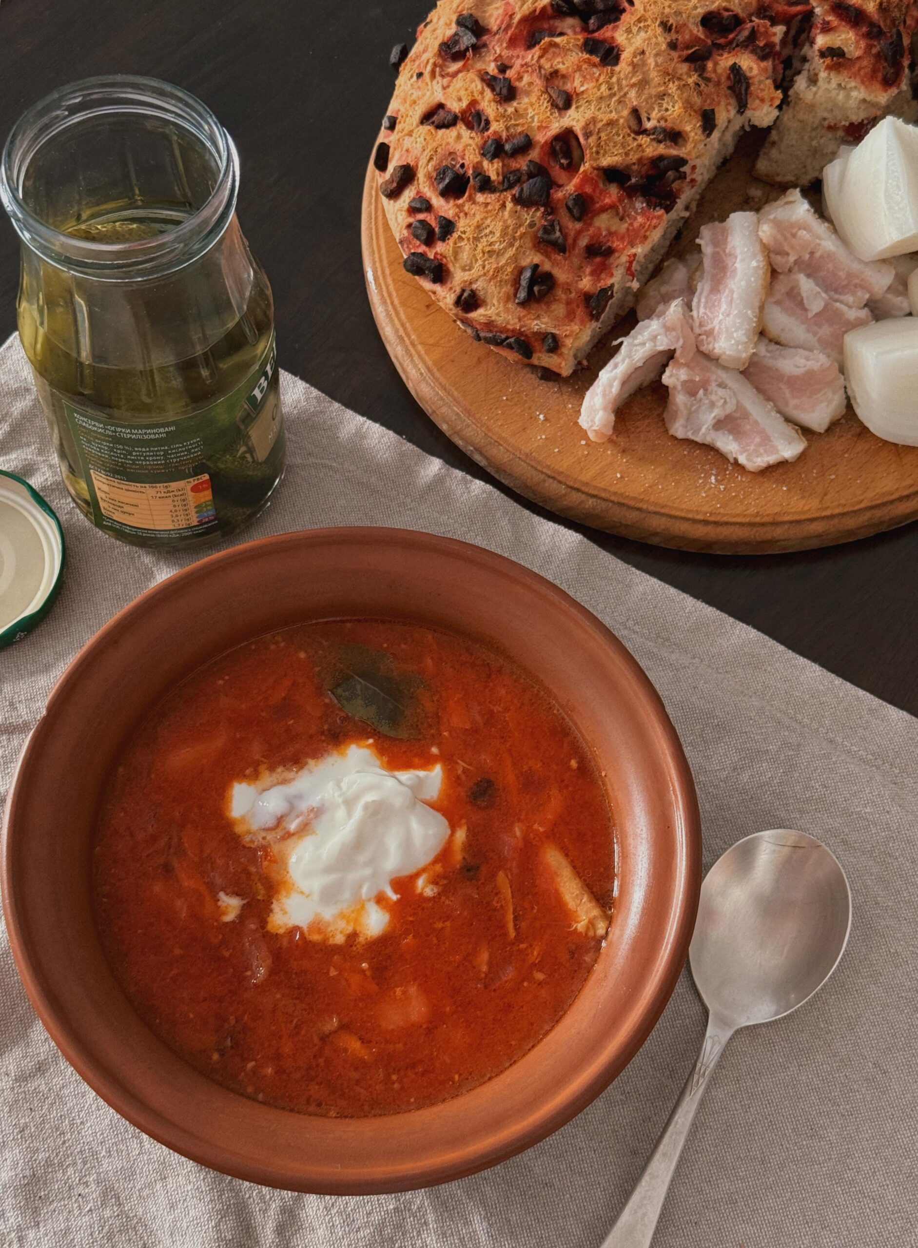 borscht with sour cream, beetroot bread, salo, pickled cucumbers ...