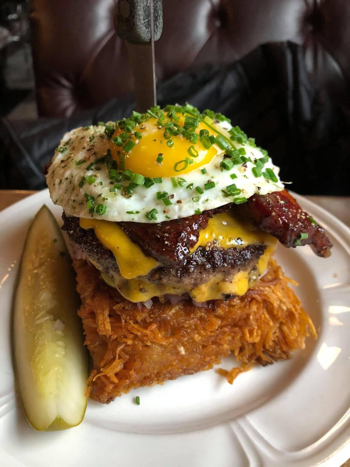[OC] Au Cheval bacon cheeseburger with a fried egg on crispy hash ...