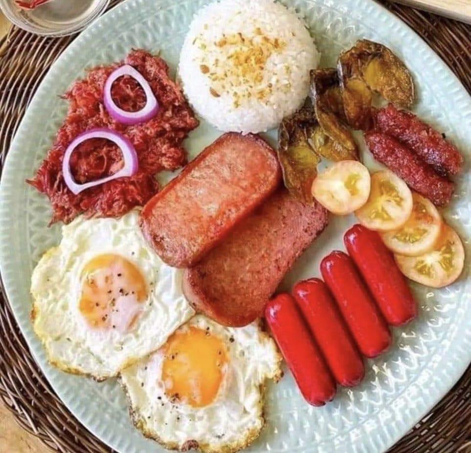 Filipino meal with garlic rice, hotdog, chorizo, corned beef, and a ...