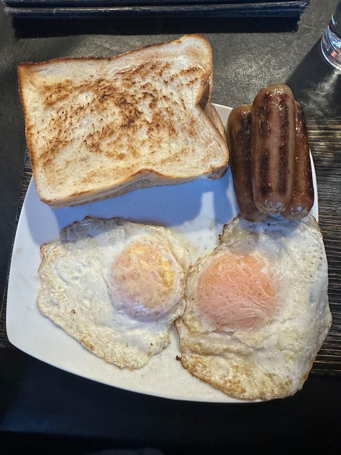 Fried duck eggs, halal beef sausages and tried bread - Dining and Cooking