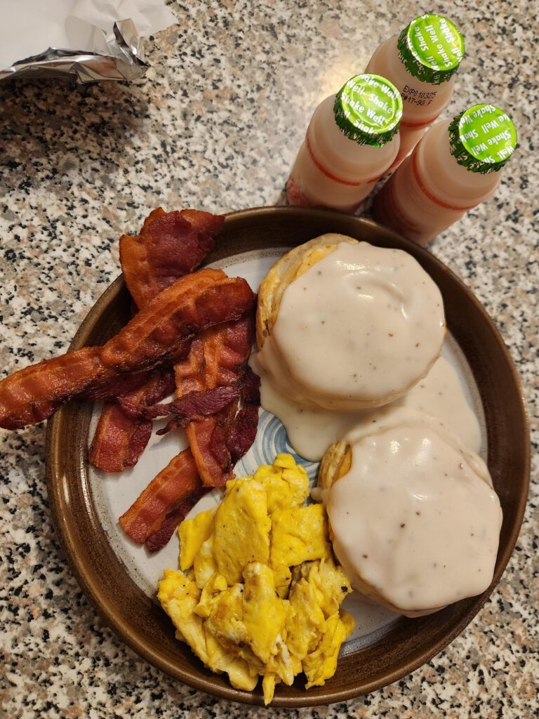 Bacon, eggs, biscuits and gravy, probiotic drink shots - Dining and Cooking