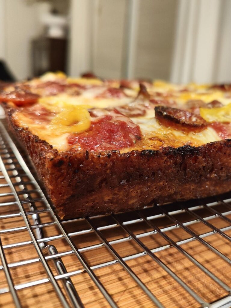 Detroit style w/ brick cheese, cheddar, ricotta, pepperoni, banana ...