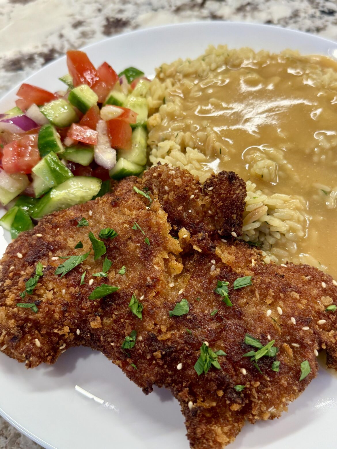 Chicken Schnitzel Dinner with Herbed Rice Pilaf, Gravy & Israeli Salad ...