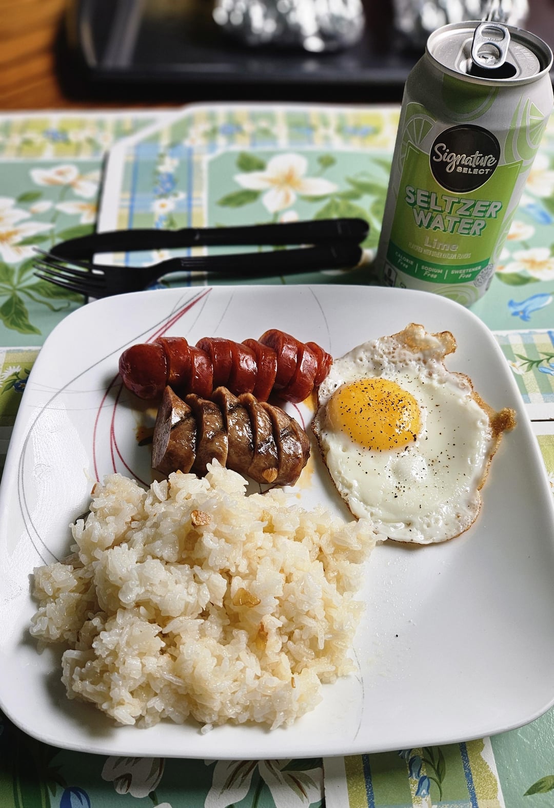 Smoked Filipino longanisa, cheddar brats, garlic fried rice, and an egg ...