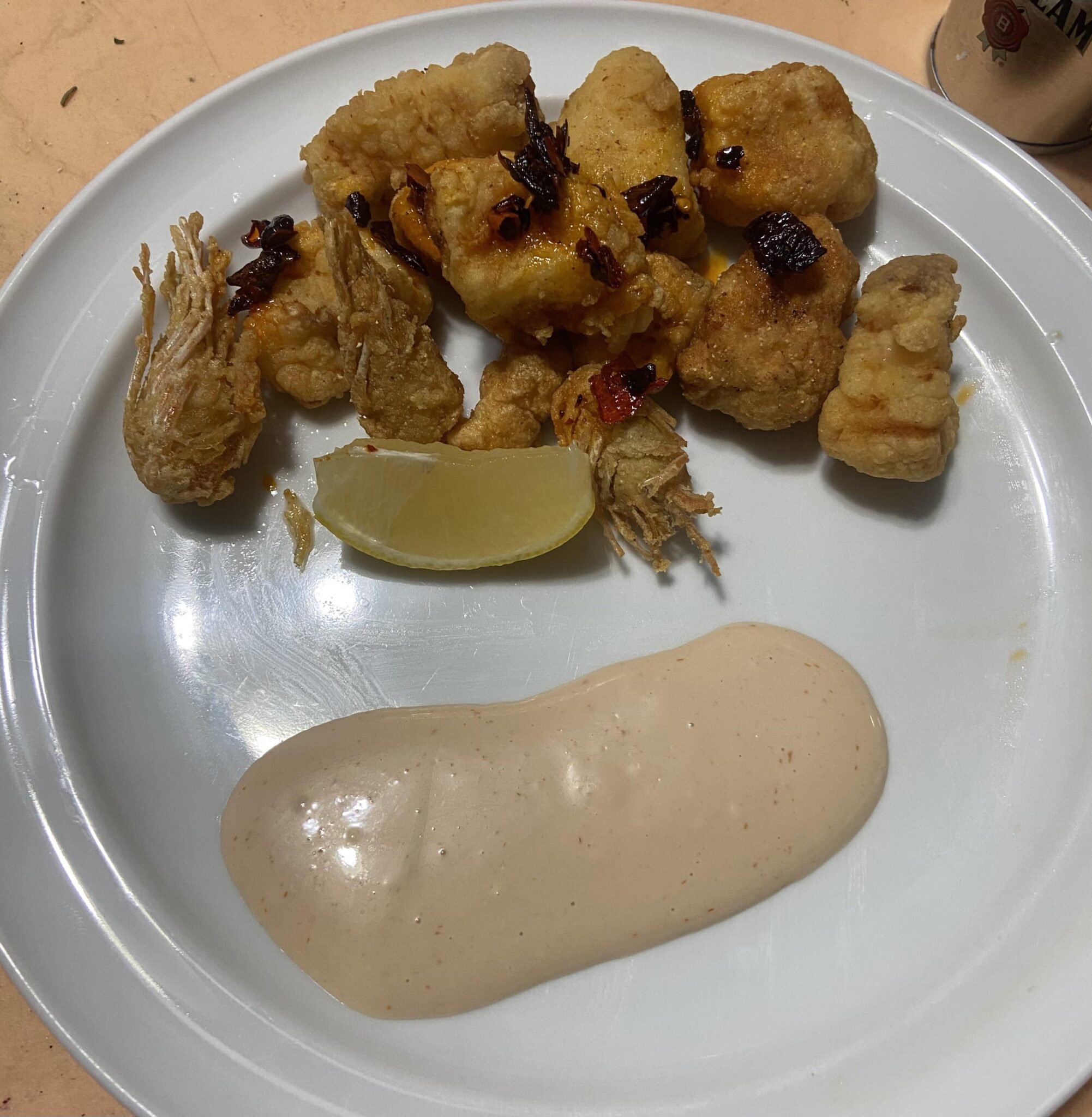 Fried alligator gar and sea spiders, with chili crisp and a chipotle ...