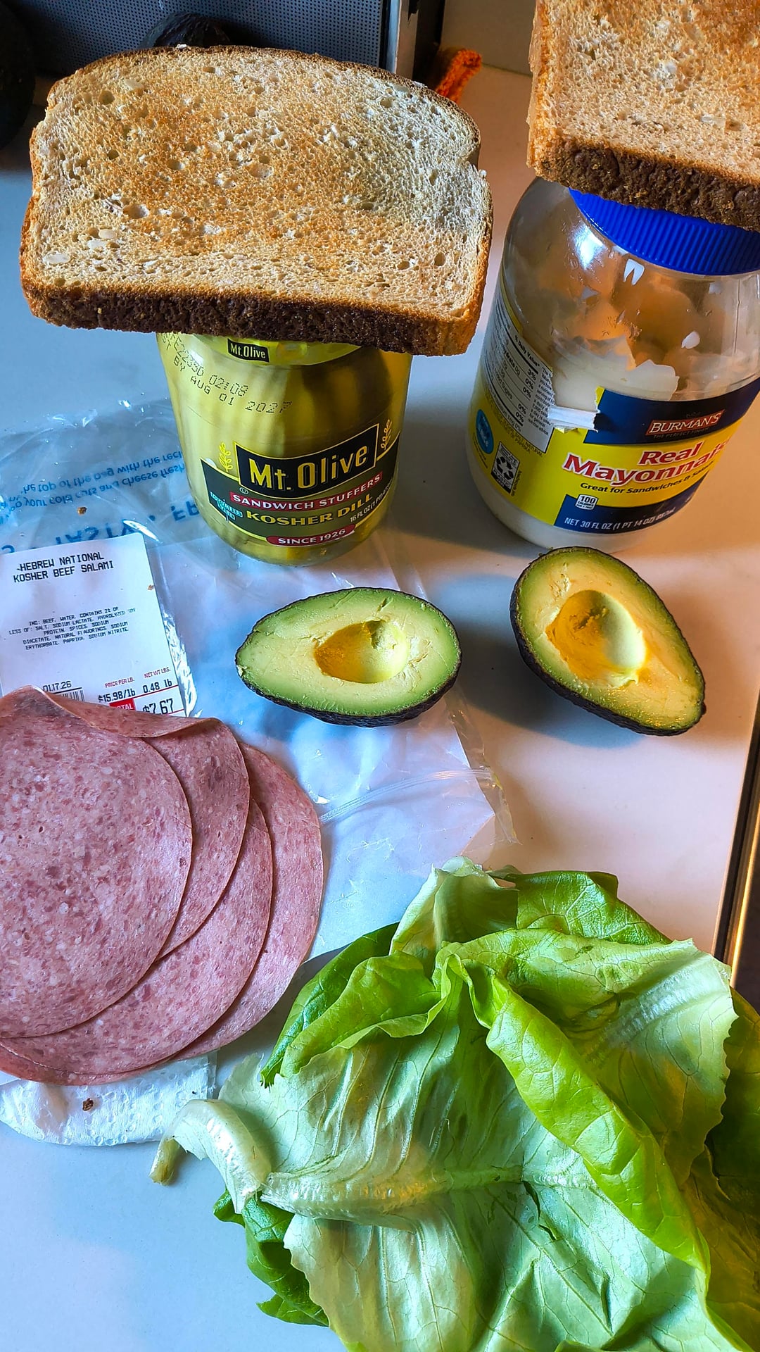 Beef salami avocado mayonnaise lettuce whole wheat toast masterpiece ...
