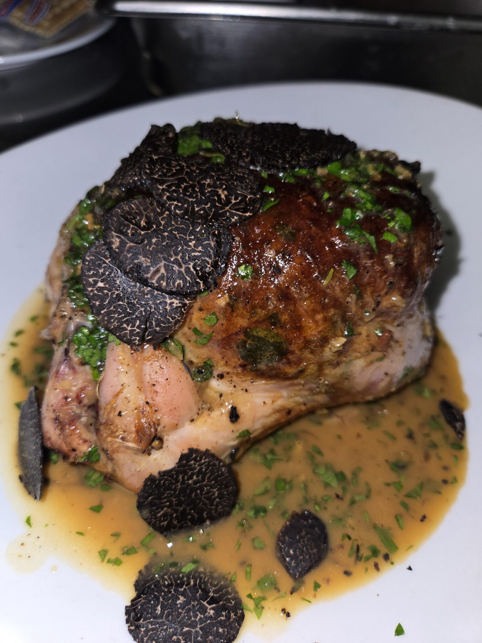 Roasted chicken with a black truffle sauce, black truffle stuffing, and ...