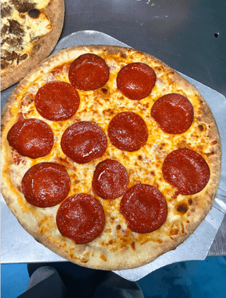 My mom made one pizza and my girlfriend made the other… which one looks ...